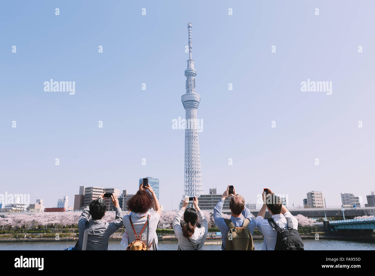 Multi-ethnic group of friends enjoying tourism in Tokyo Stock Photo - Alamy