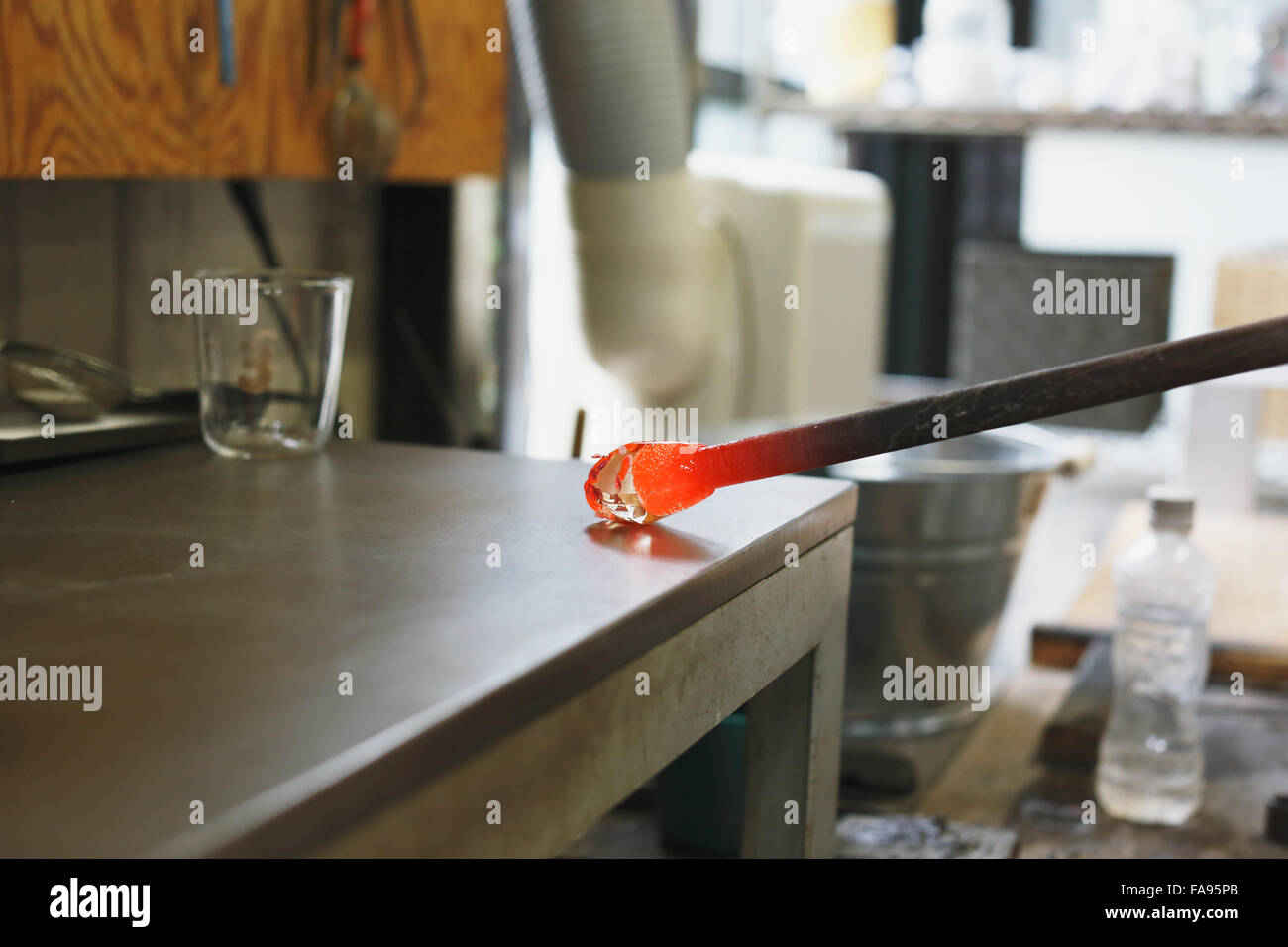 Glass being prepared in artisan studio Stock Photo - Alamy