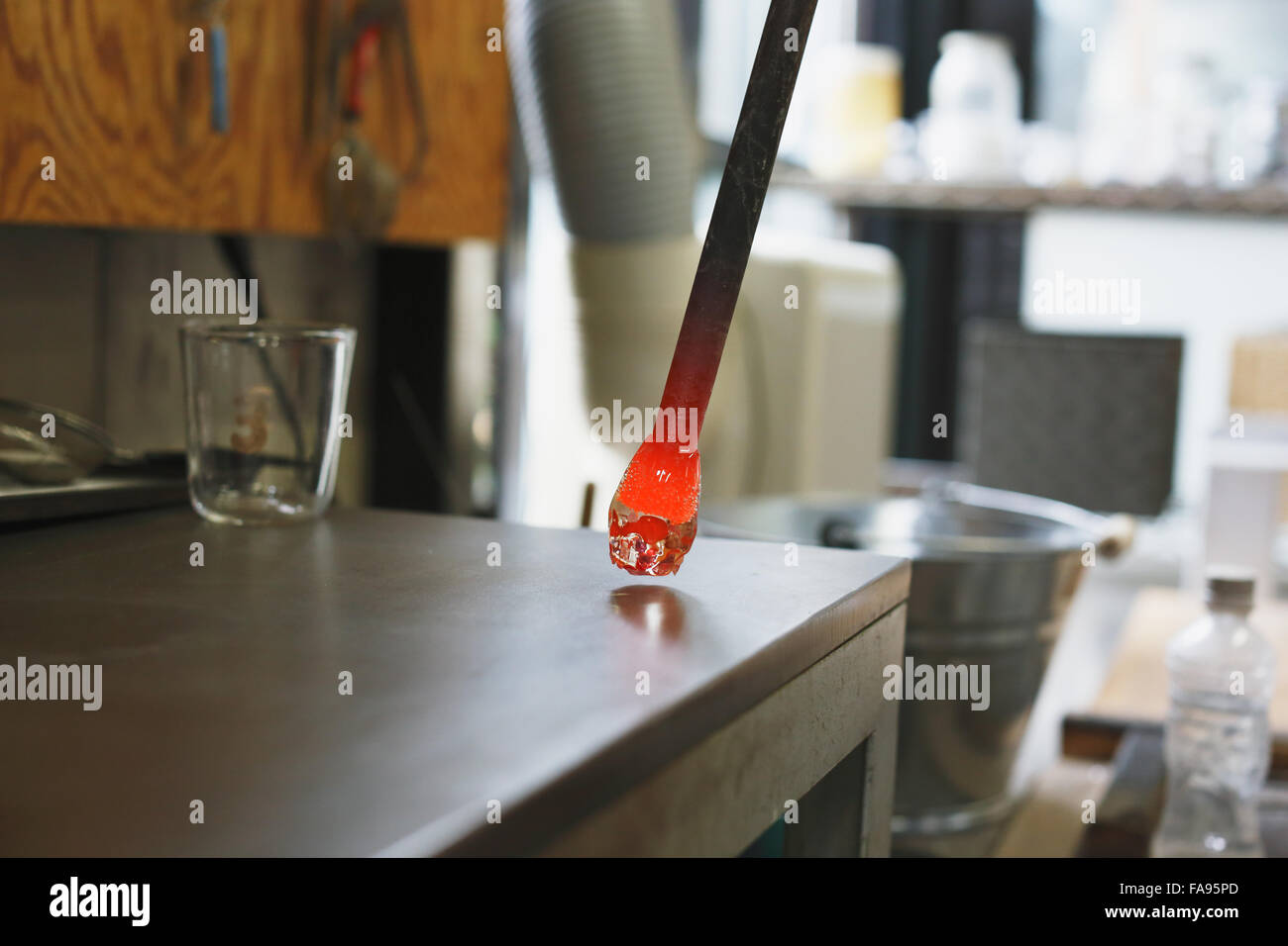 Glass being prepared in artisan studio Stock Photo - Alamy