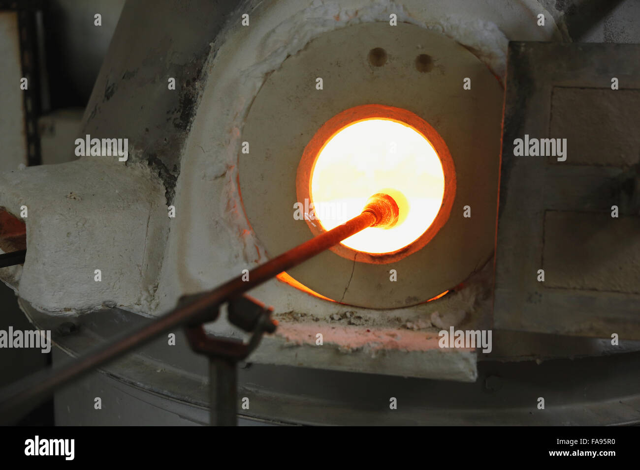 Glass being prepared in artisan studio Stock Photo - Alamy