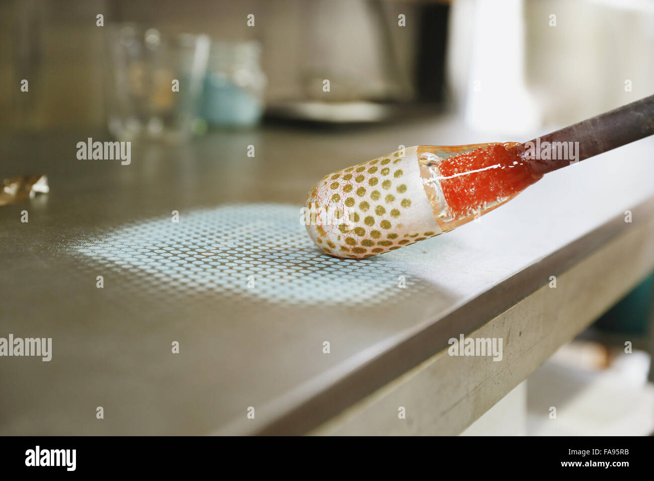 Glass being prepared in artisan studio Stock Photo - Alamy