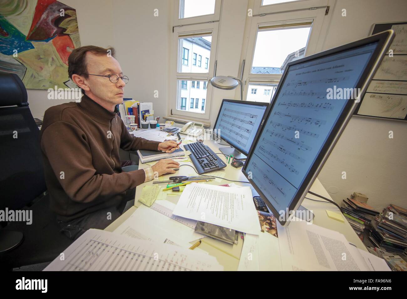 Mainz, Germany. 17th Dec, 2015. Editor Andreas Krause works on musical ...