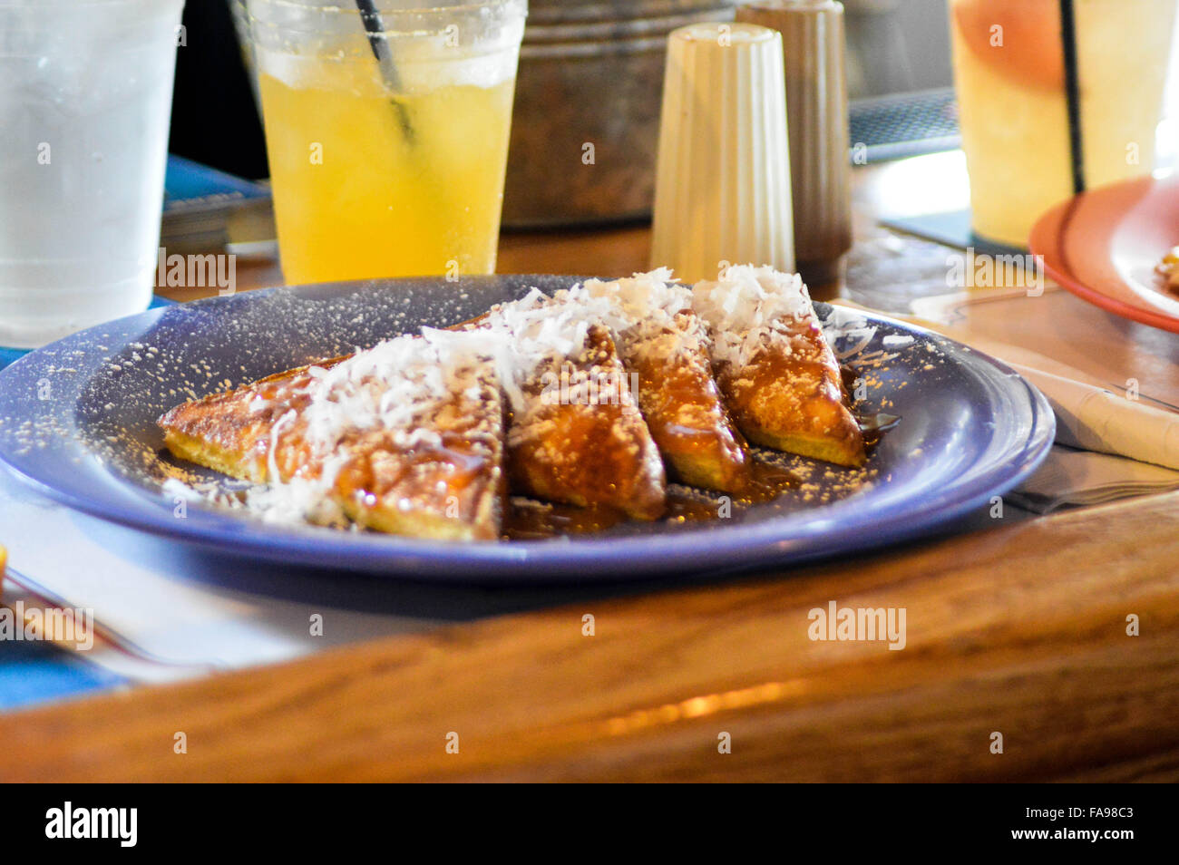 Coconut waffles at a beach restaurant Stock Photo - Alamy
