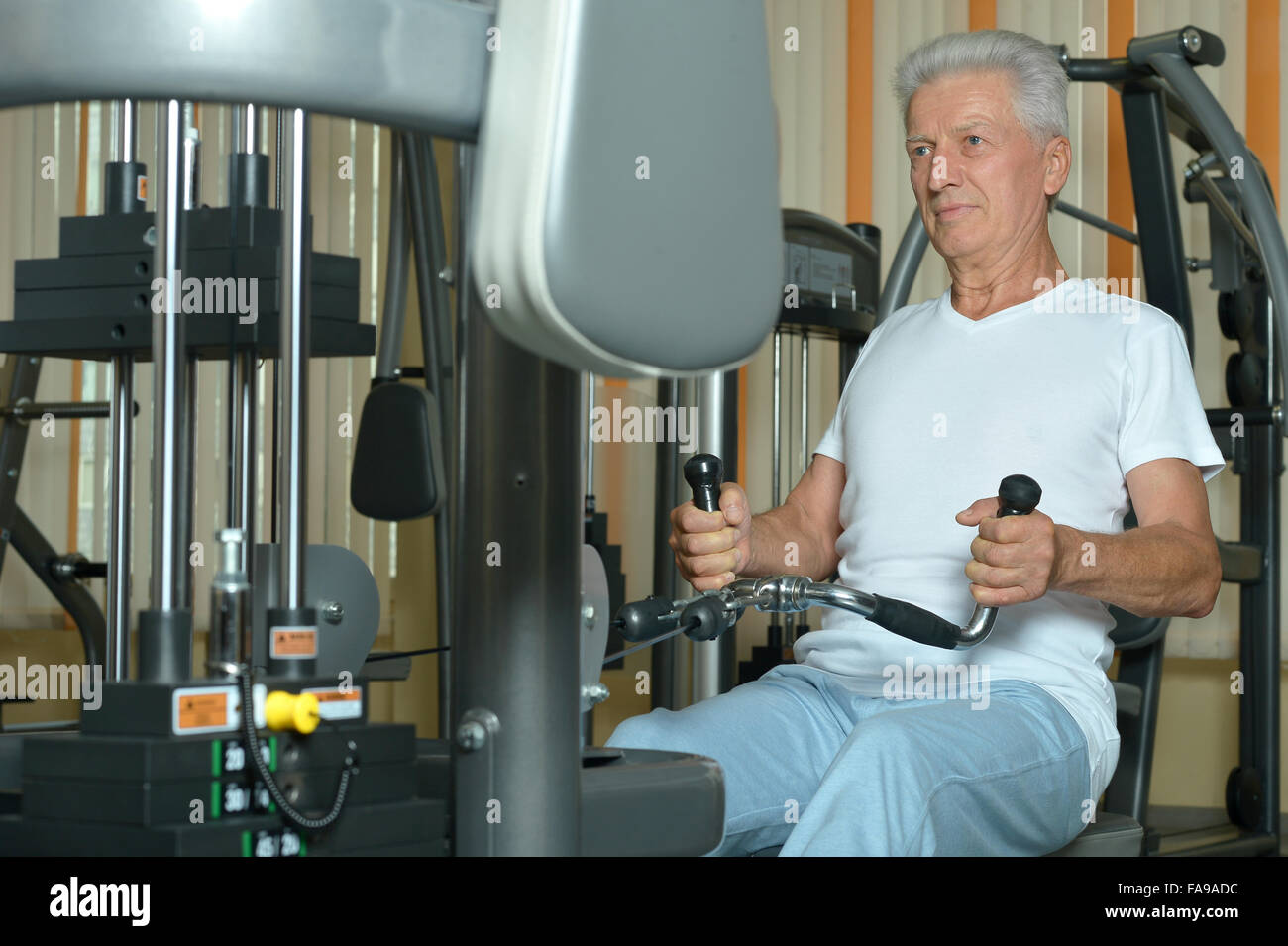 Elderly man in gym Stock Photo - Alamy