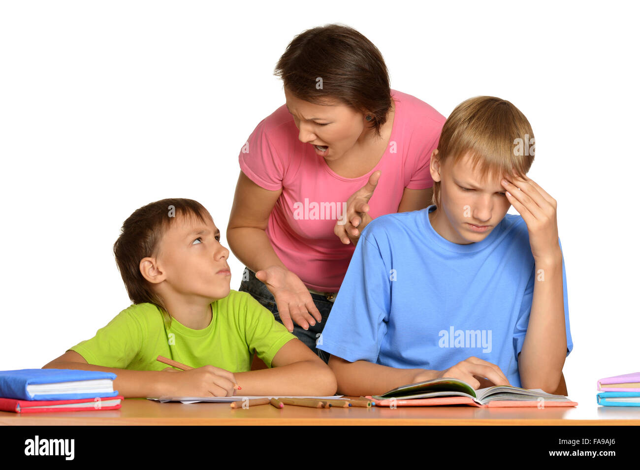 Mother helping kids with homework Stock Photo - Alamy