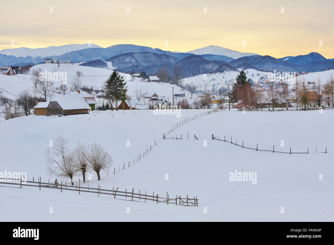 Winter romanian village and mountain landscape Stock Photo - Alamy