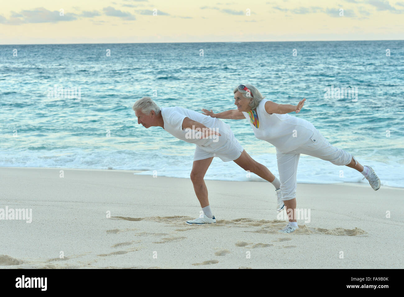 Senior couple exercising in summer Stock Photo - Alamy
