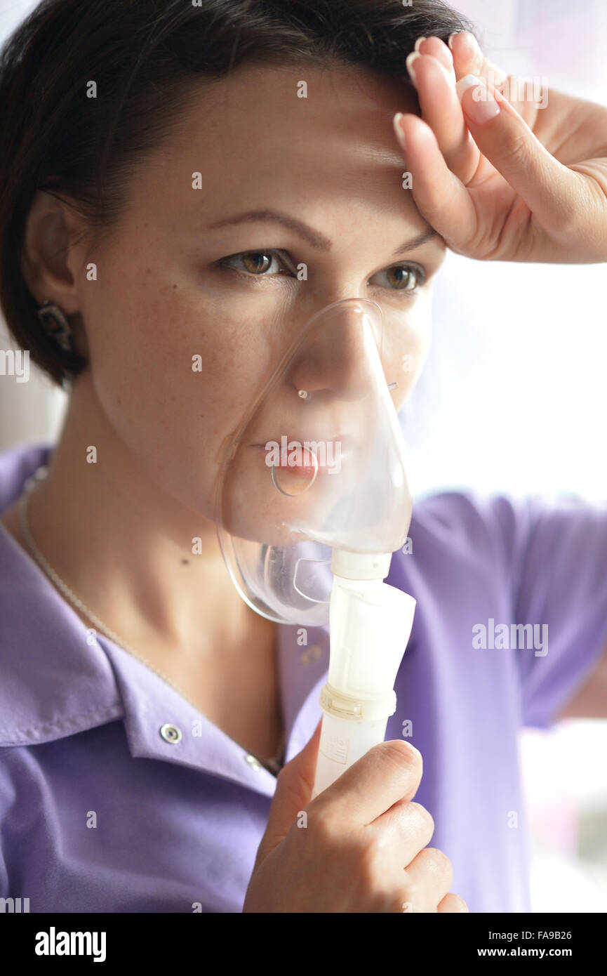 Young woman doing inhalation Stock Photo - Alamy