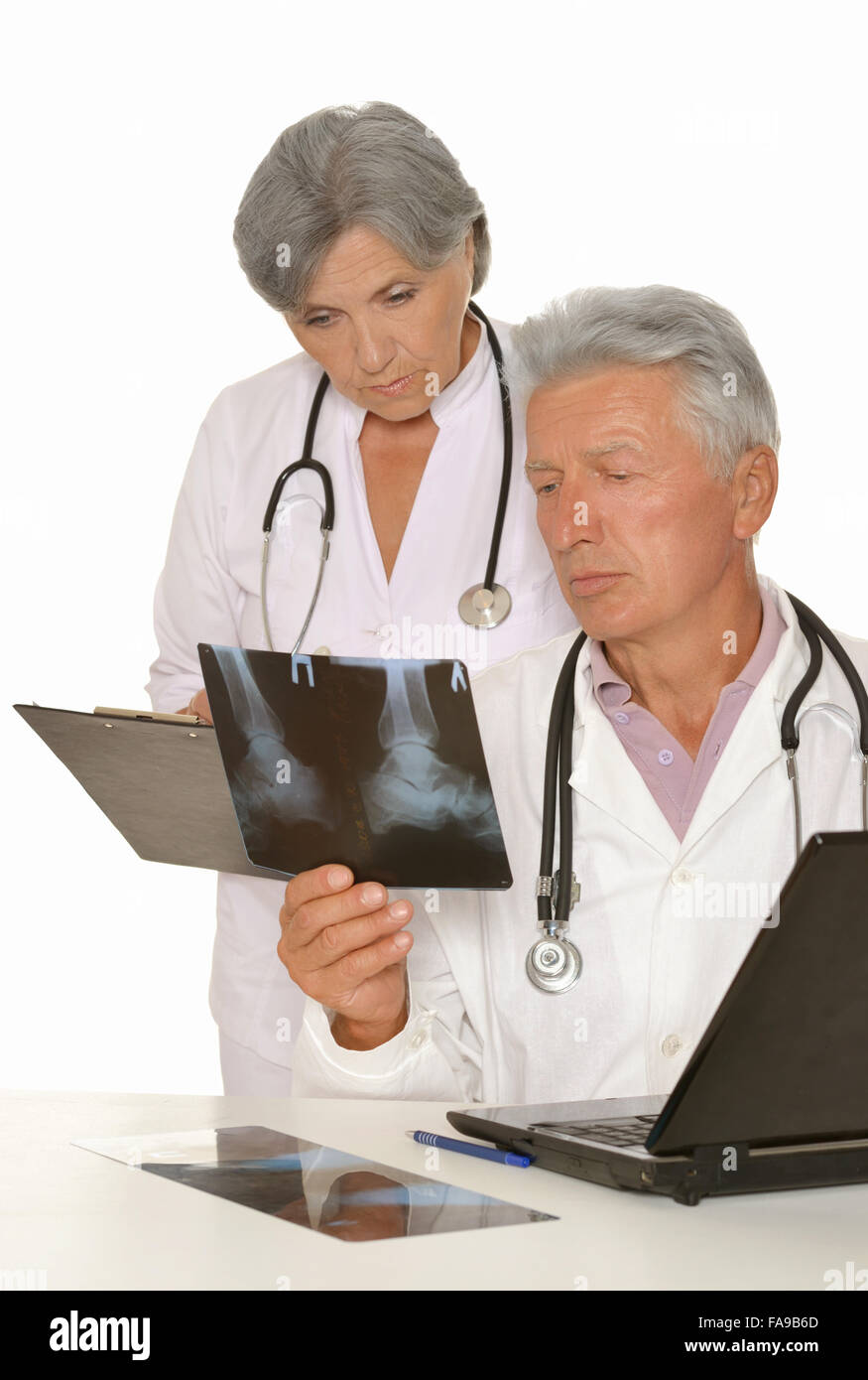 Doctors with stethoscopes looking at x-ray Stock Photo - Alamy