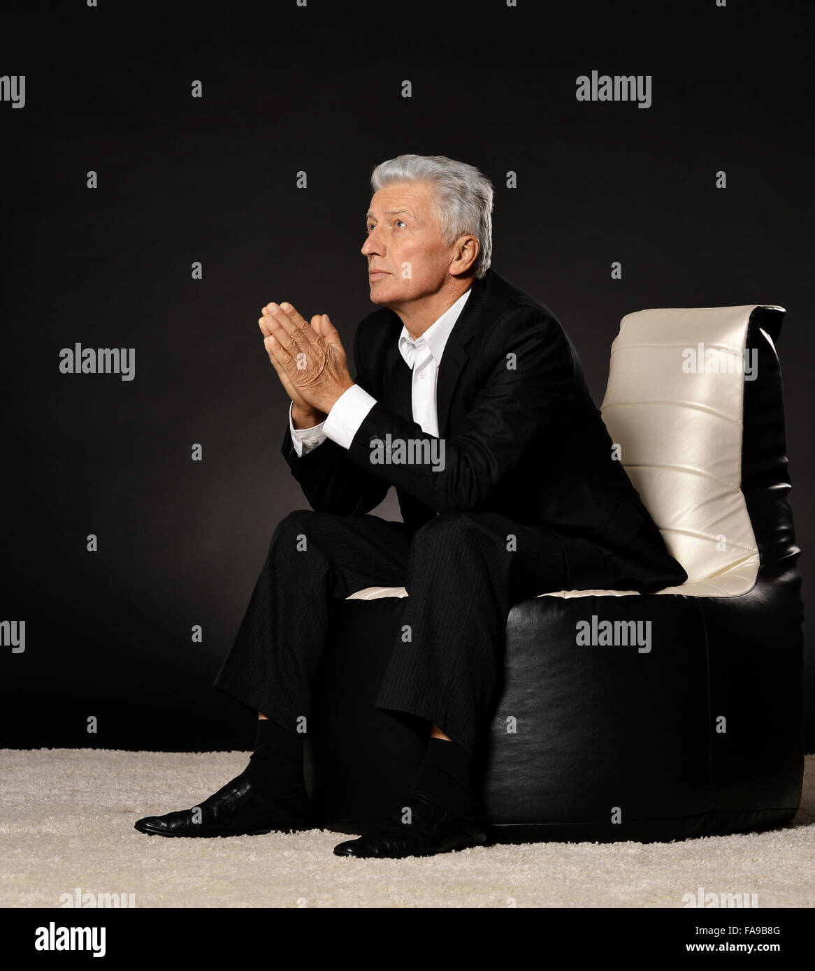 Man in suit praying looking hi-res stock photography and images - Alamy