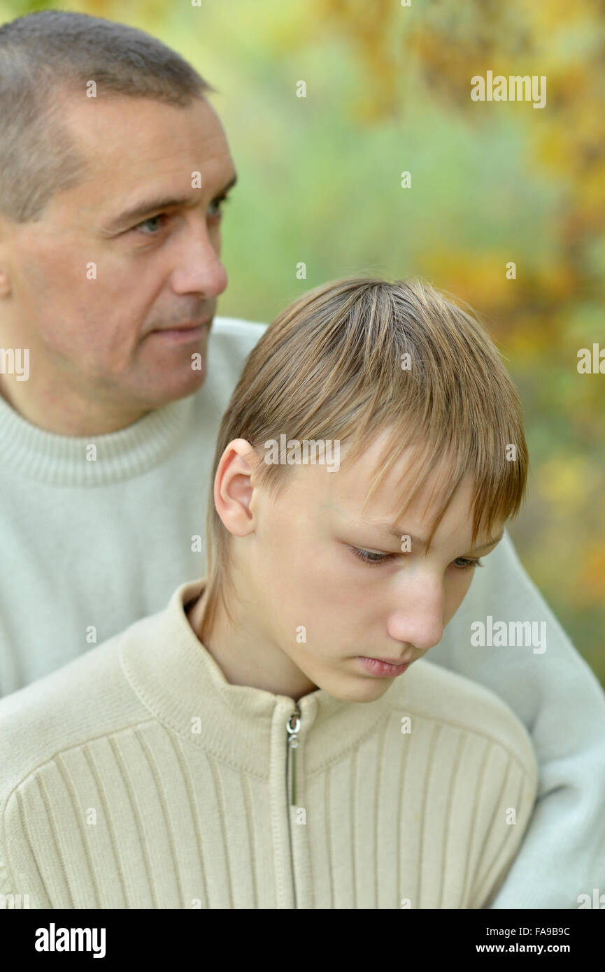 Sad father and boy Stock Photo - Alamy