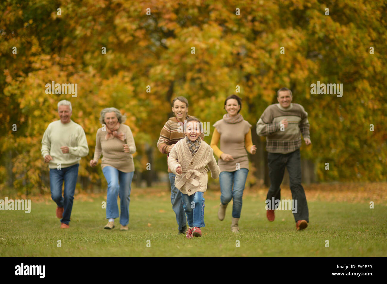 Activity happy family relaxing in forest Stock Photo - Alamy
