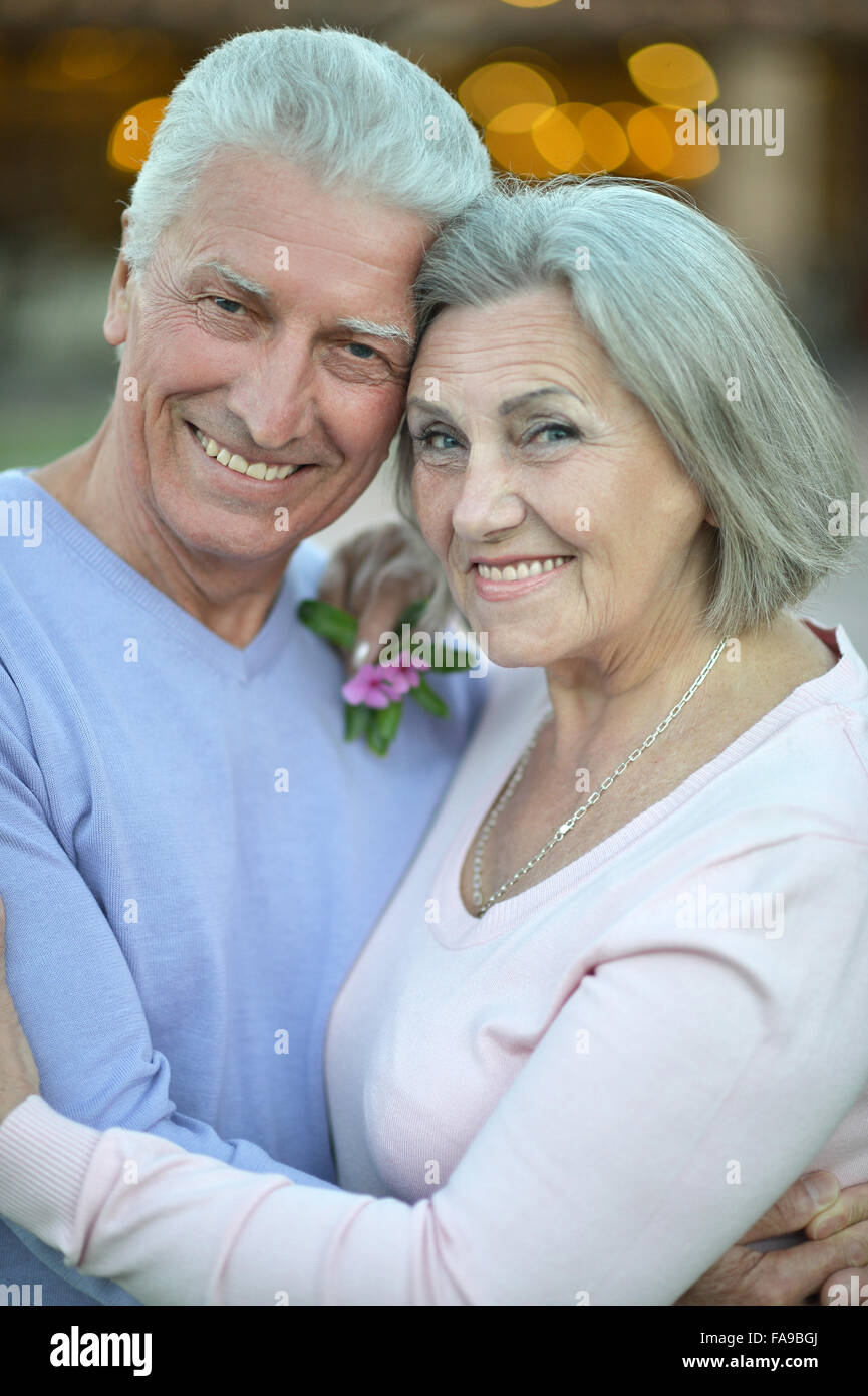 Elderly couple standing outdoors Stock Photo - Alamy