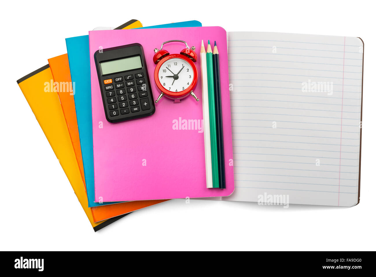 Open notebook with set of crayons and calculator Stock Photo - Alamy