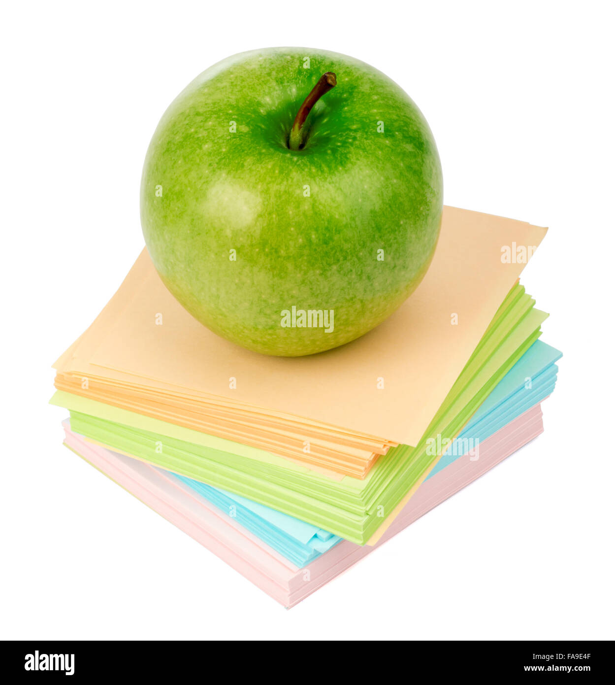Fresh green apple on stack of stickers Stock Photo - Alamy