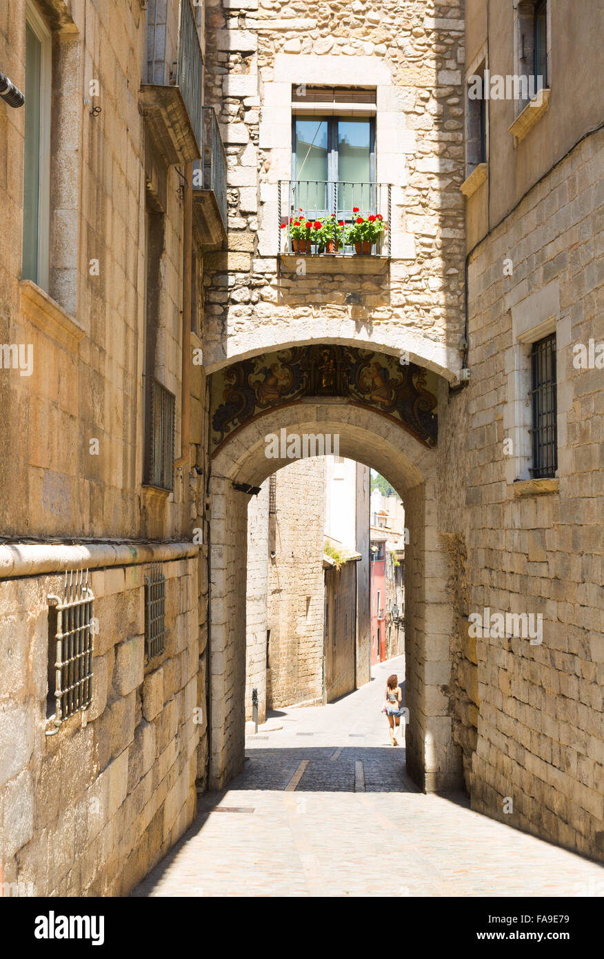 Arch over old street of european city. Girona, Spain Stock Photo - Alamy