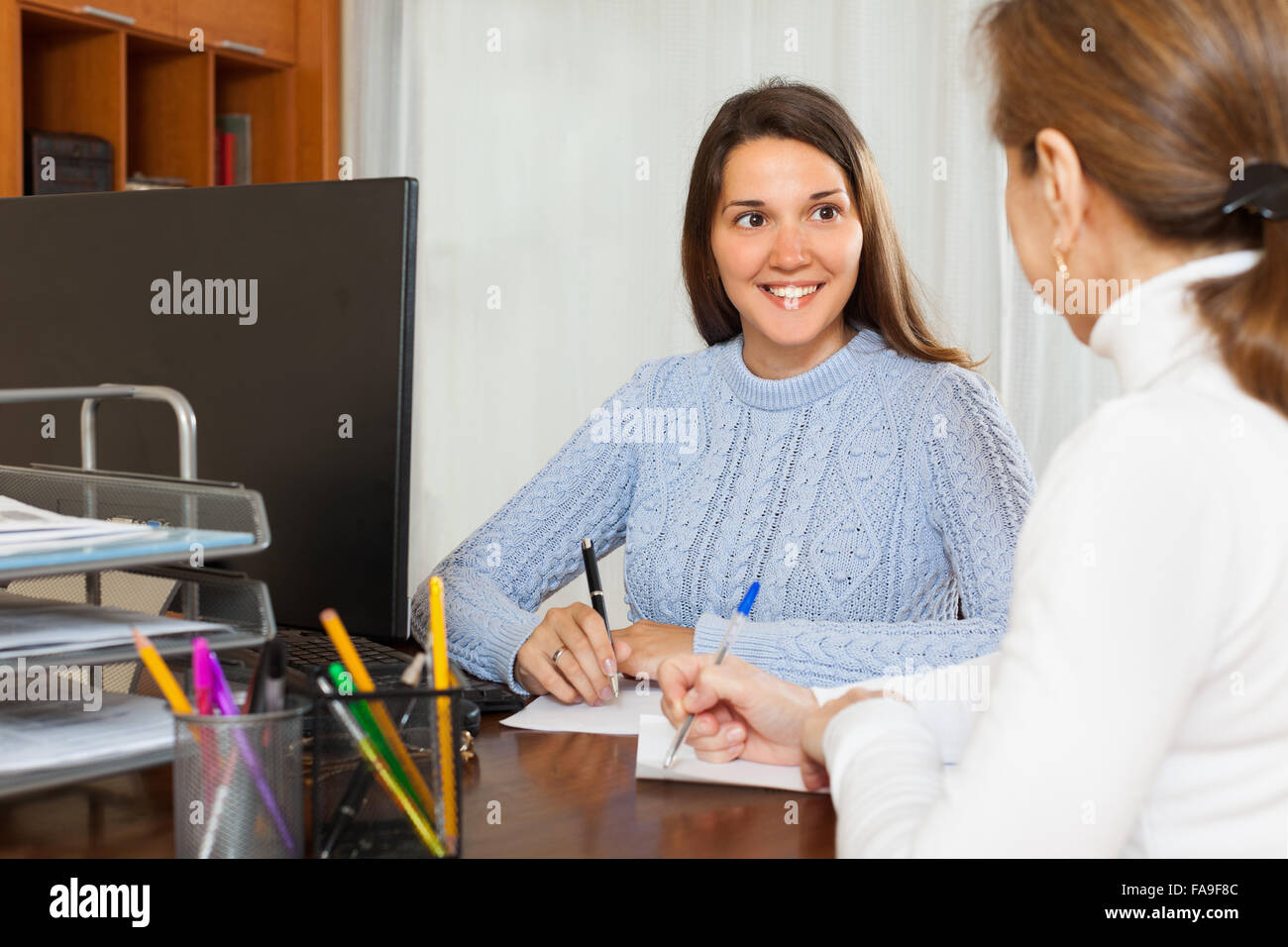 Girl questionnaire for employee of the company at table in office Stock ...