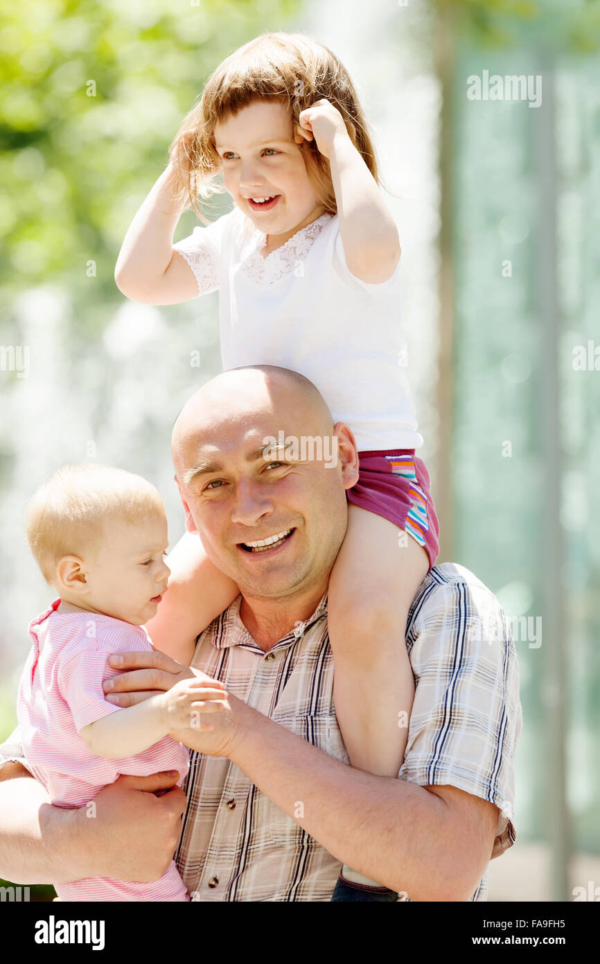 portrait of happy man with two children Stock Photo - Alamy