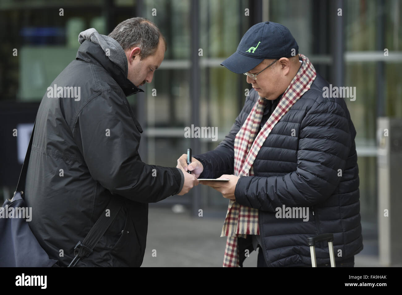 Animator and artist Peter Sohn signs an autograph for a fan as he ...