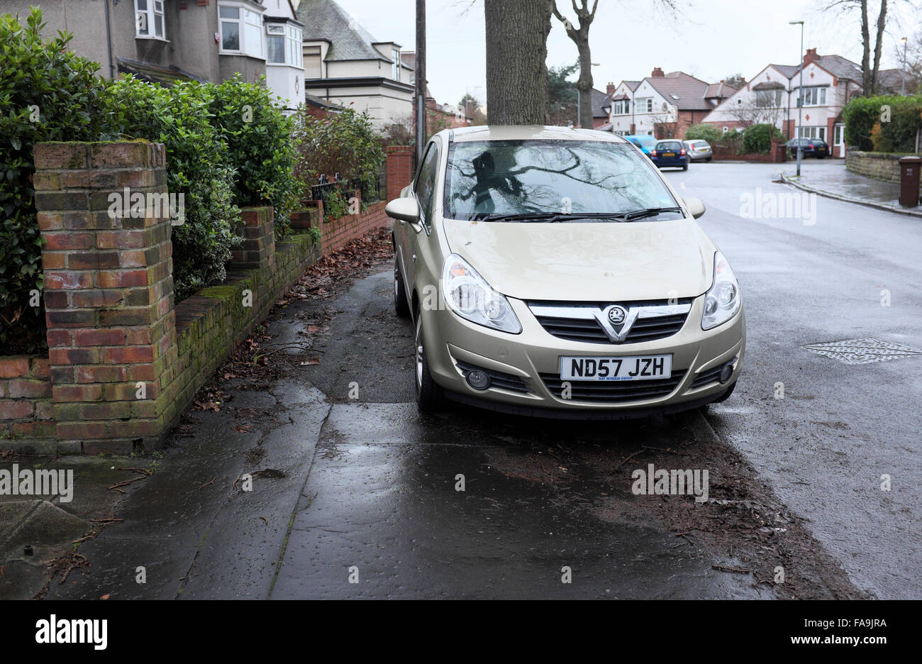 A car is parked on the pavement obstructing the way for pedestrians ...