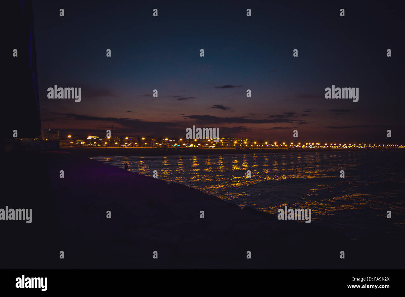 valencia beach at night, seen from the harbor, Spain Stock Photo - Alamy