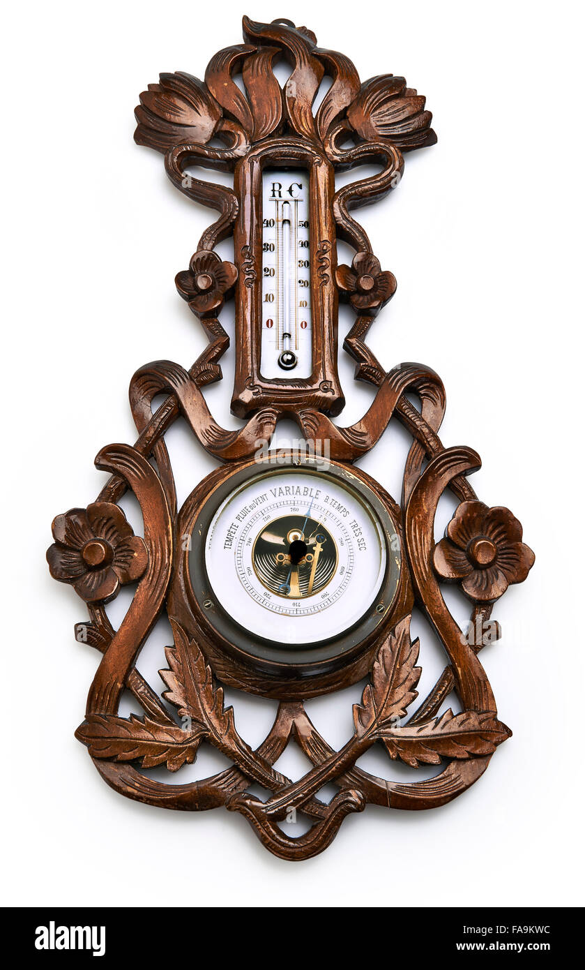 Traditional wooden barometer and thermometer isolated on a white ...