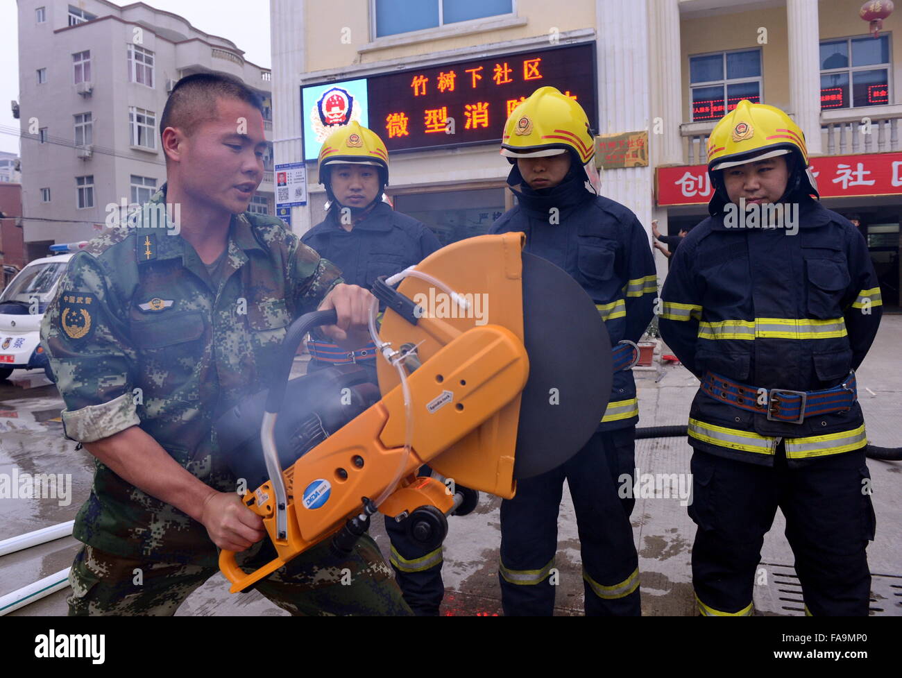 Jinjiang, China's Fujian Province. 24th Dec, 2015. A firefighter shows ...