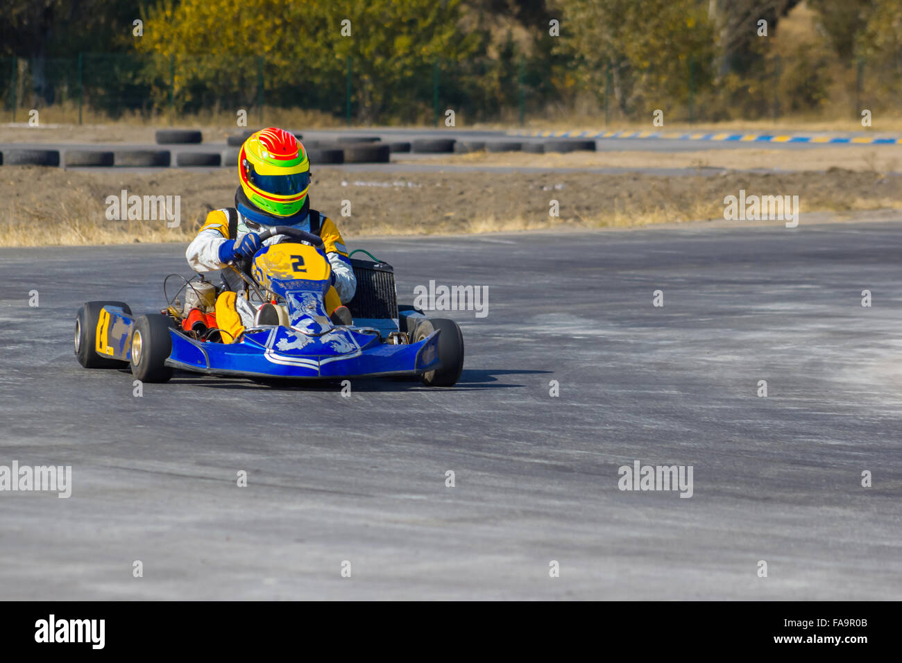 Karting - driver in helmet on kart circuit Stock Photo - Alamy