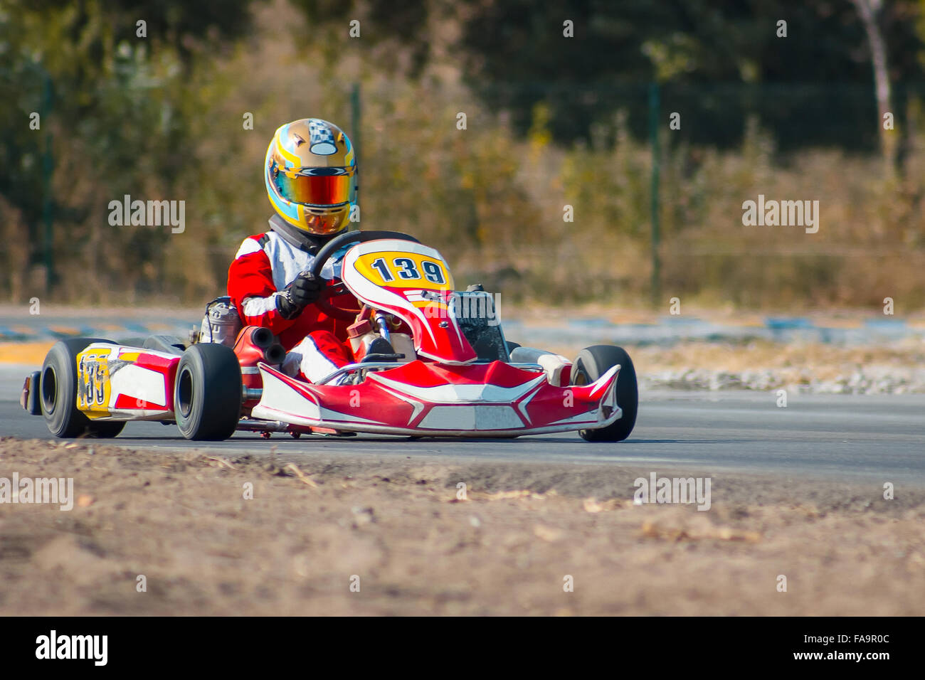 Karting - driver in helmet on kart circuit Stock Photo - Alamy