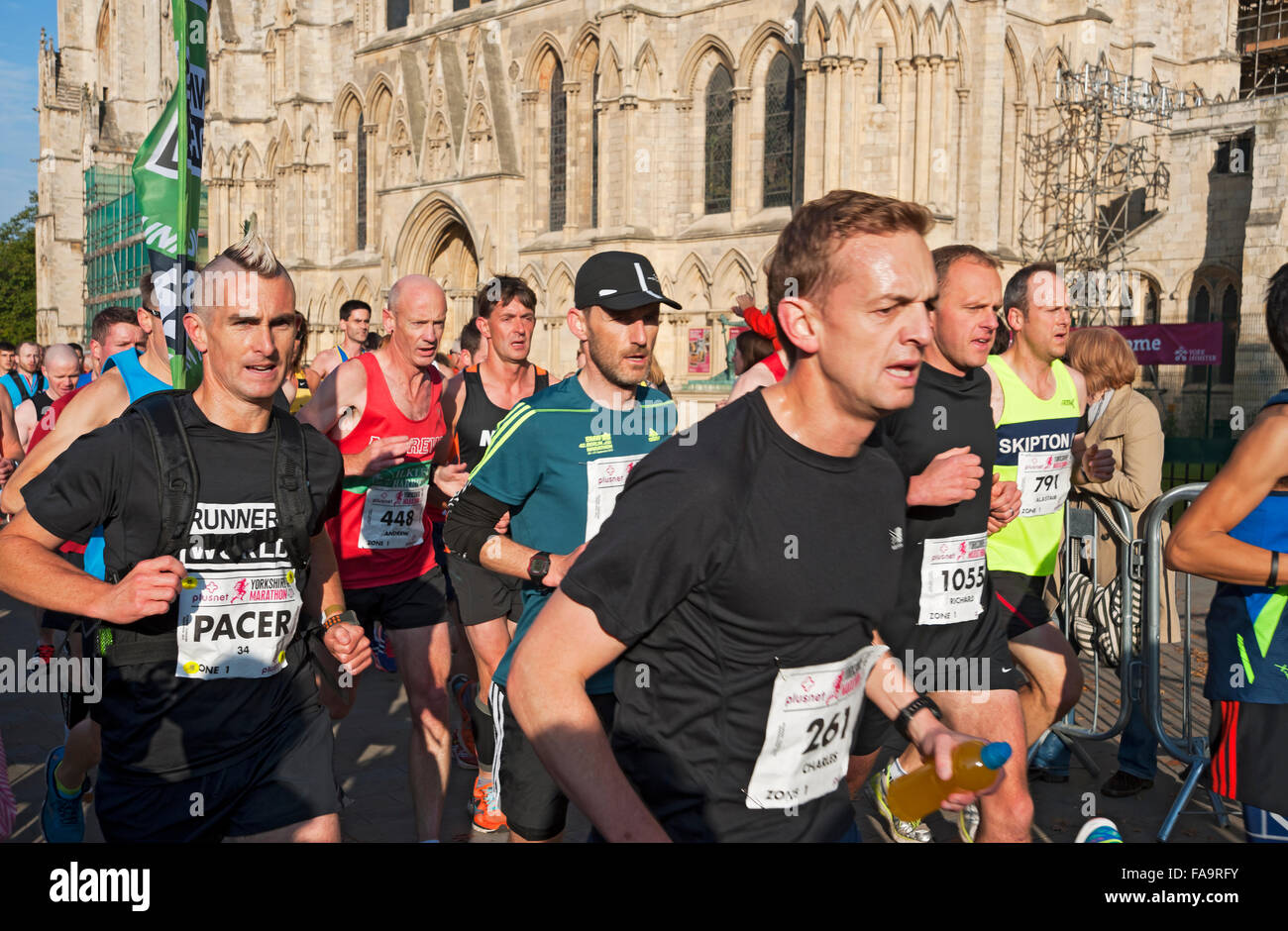 Competitors people men male running runners through the city centre in ...