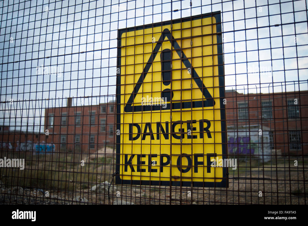 Danger keep out sign on a metal fence Stock Photo - Alamy