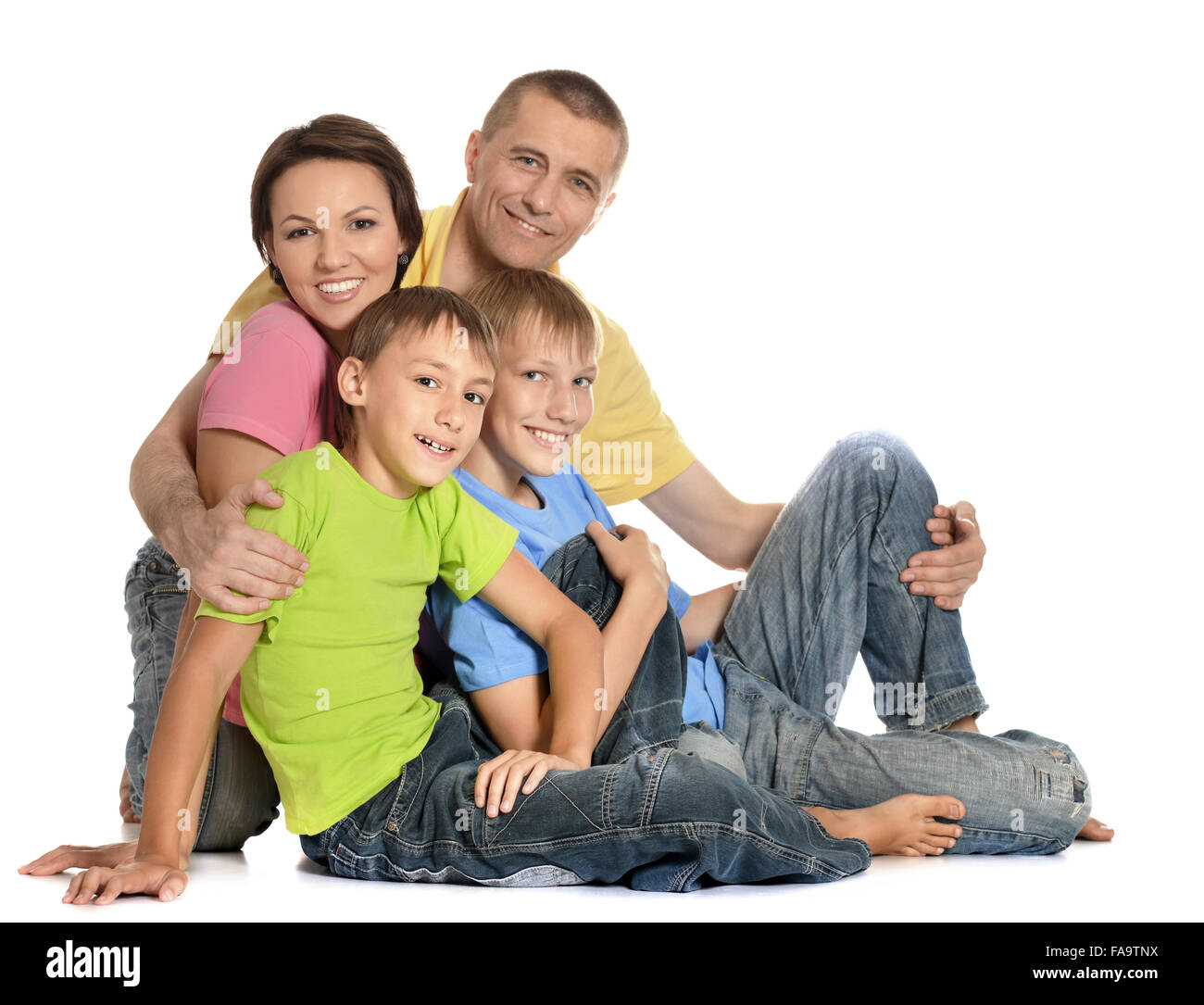 Happy family of four Stock Photo - Alamy
