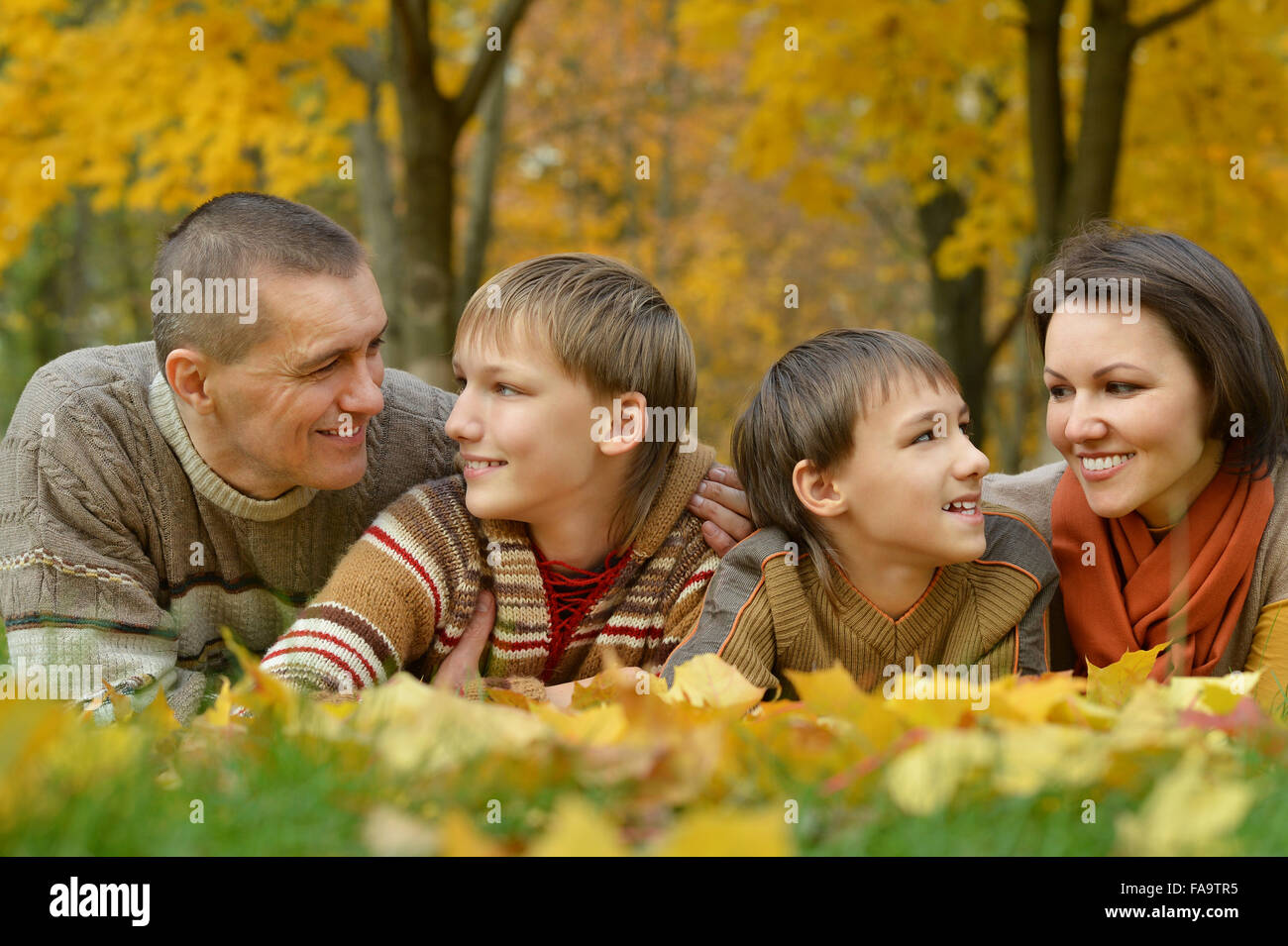 Portrait of family relaxing Stock Photo - Alamy