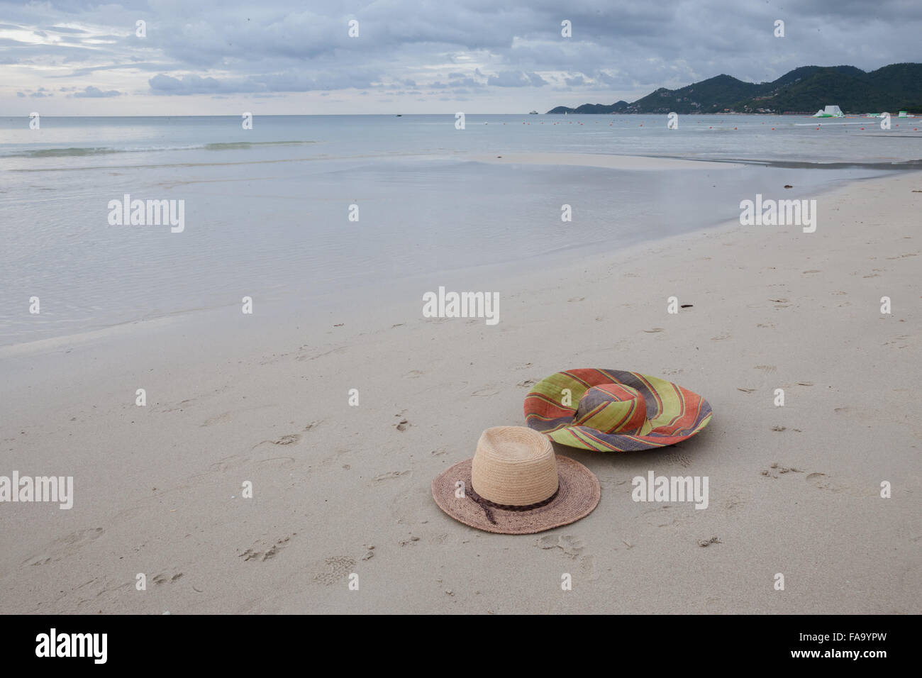 Beach on tropical island. Clear blue water, sand, clouds Stock Photo ...