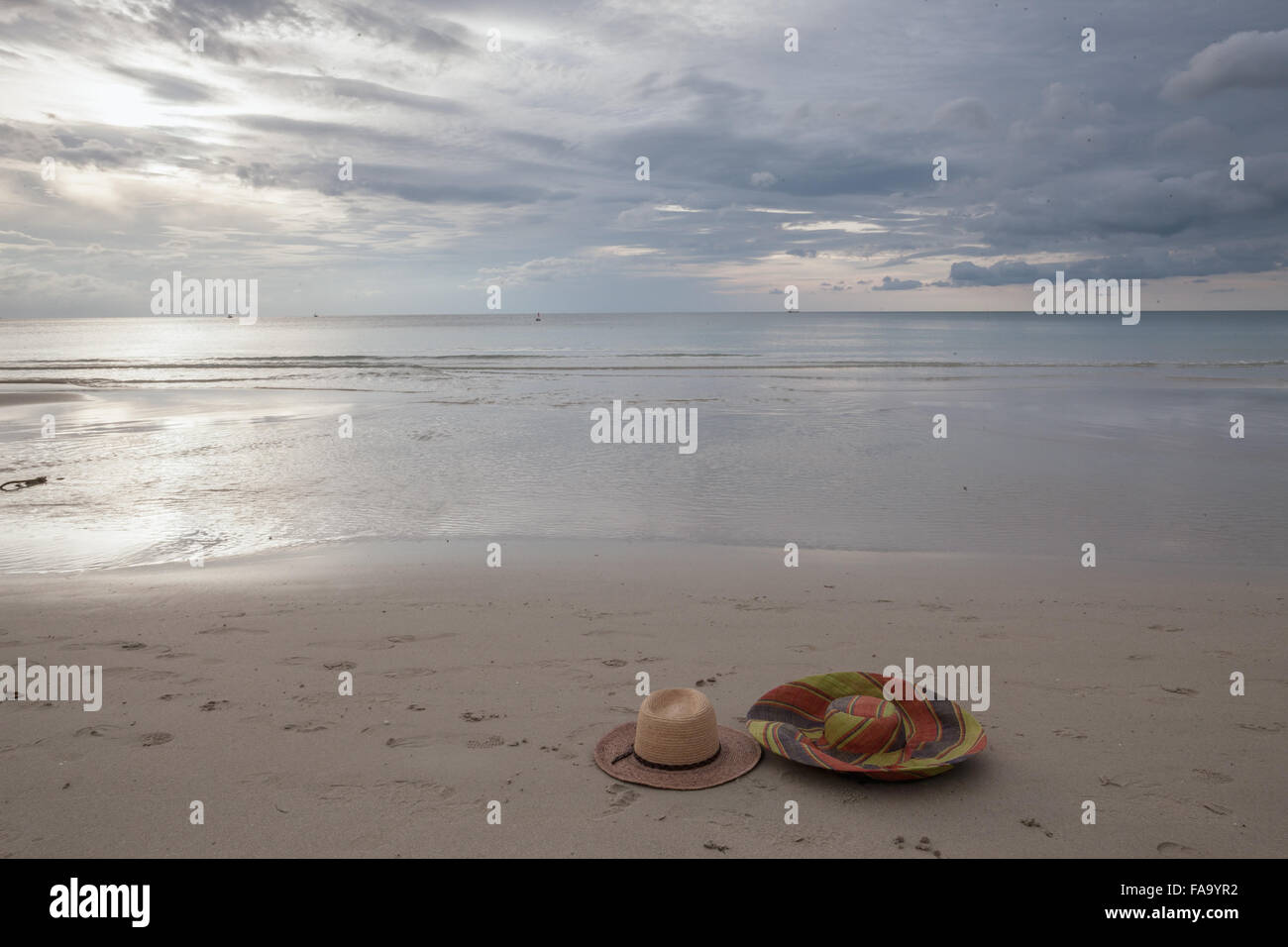Beach on tropical island. Clear blue water, sand, clouds Stock Photo ...