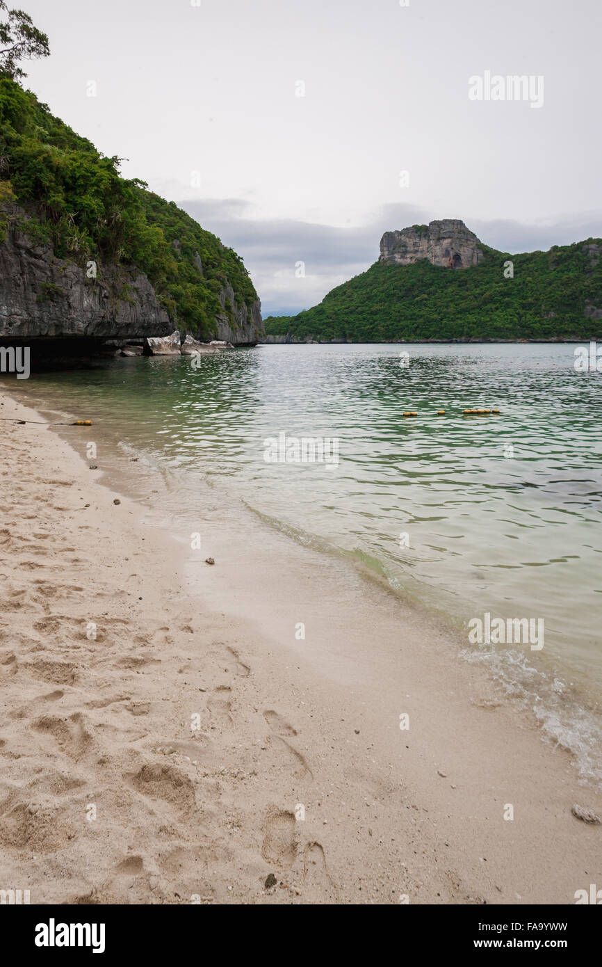 Beach on tropical island. Clear blue water, sand, clouds Stock Photo ...