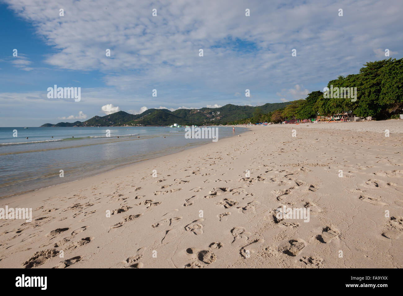 Beach on tropical island. Clear blue water, sand, clouds Stock Photo ...