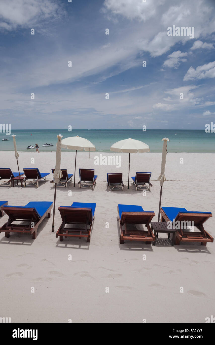 Beach on tropical island. Clear blue water, sand, clouds Stock Photo ...