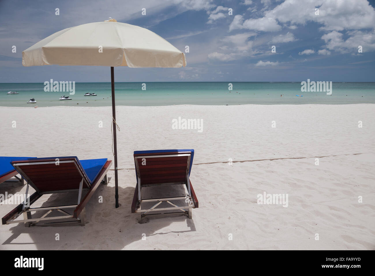 Beach on tropical island. Clear blue water, sand, clouds Stock Photo ...