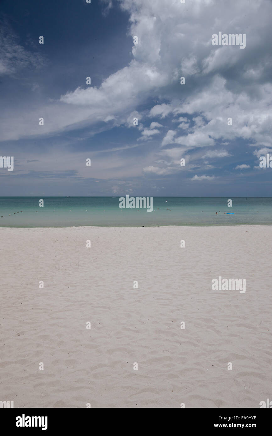 Beach on tropical island. Clear blue water, sand, clouds Stock Photo ...