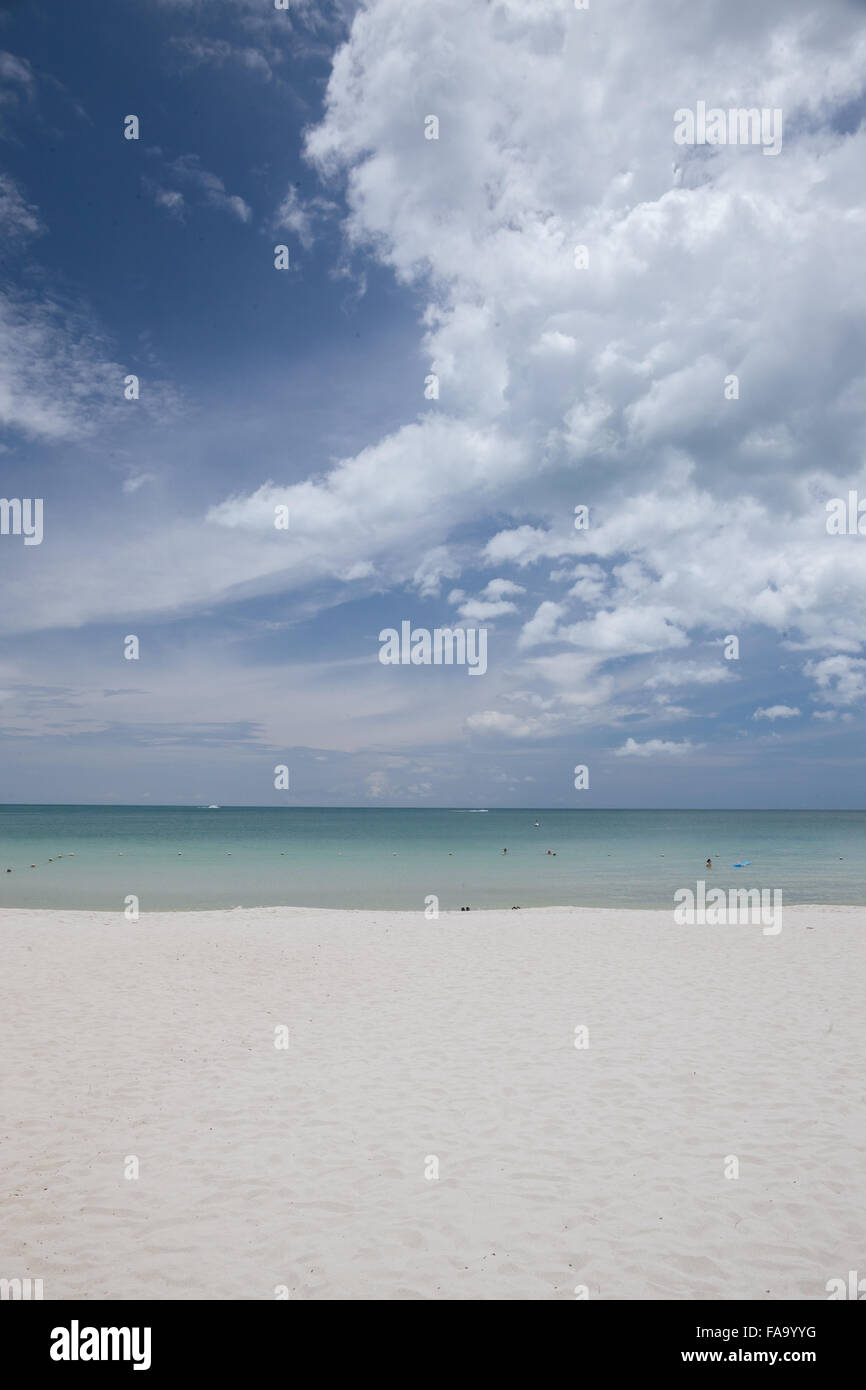 Beach on tropical island. Clear blue water, sand, clouds Stock Photo ...
