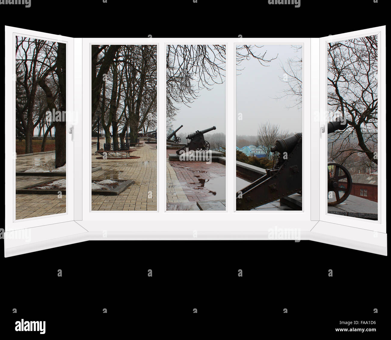 window overlooking the beautiful view to the park with ancient cannons ...