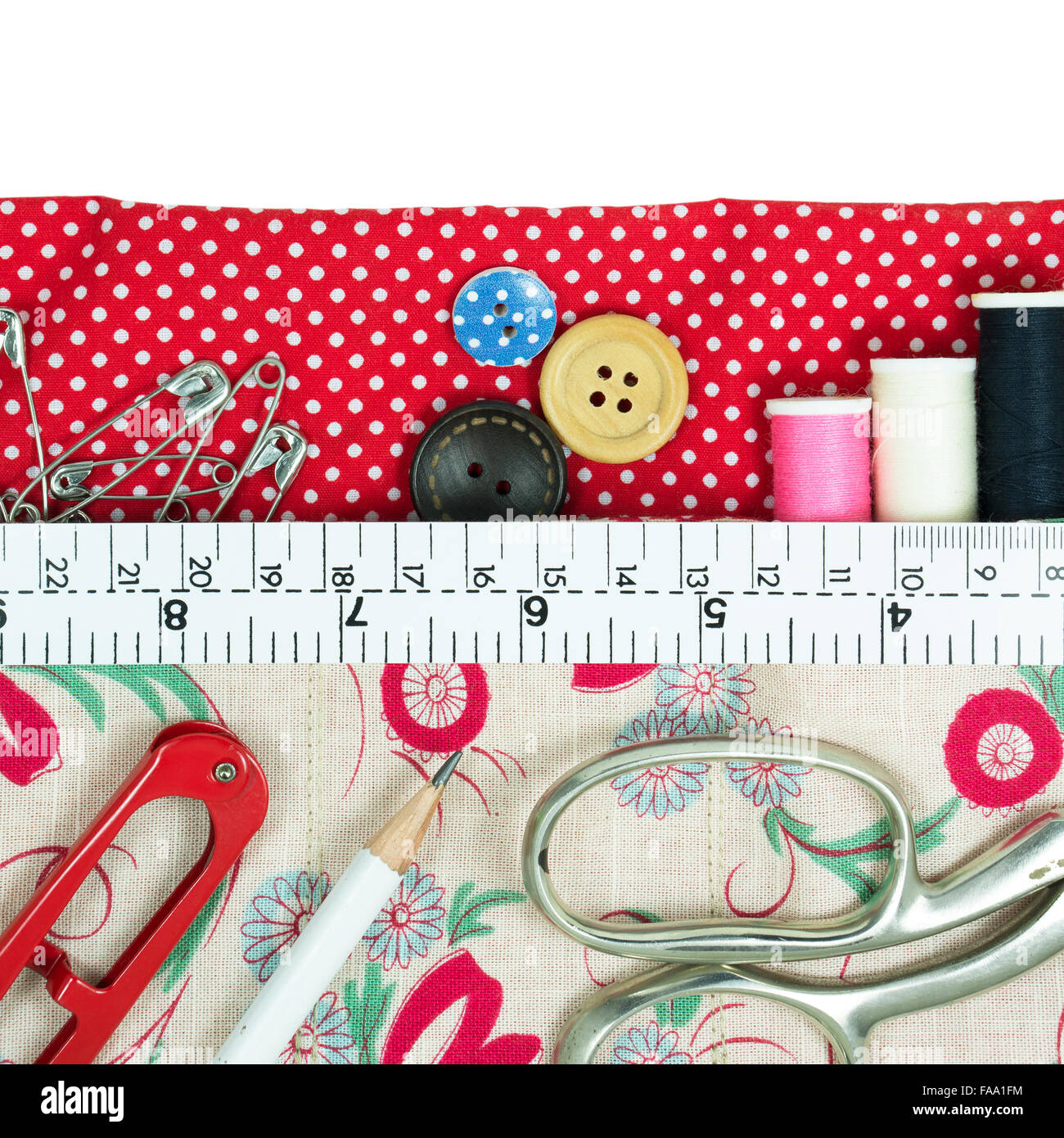 Sewing kit with fabric on white background Stock Photo - Alamy