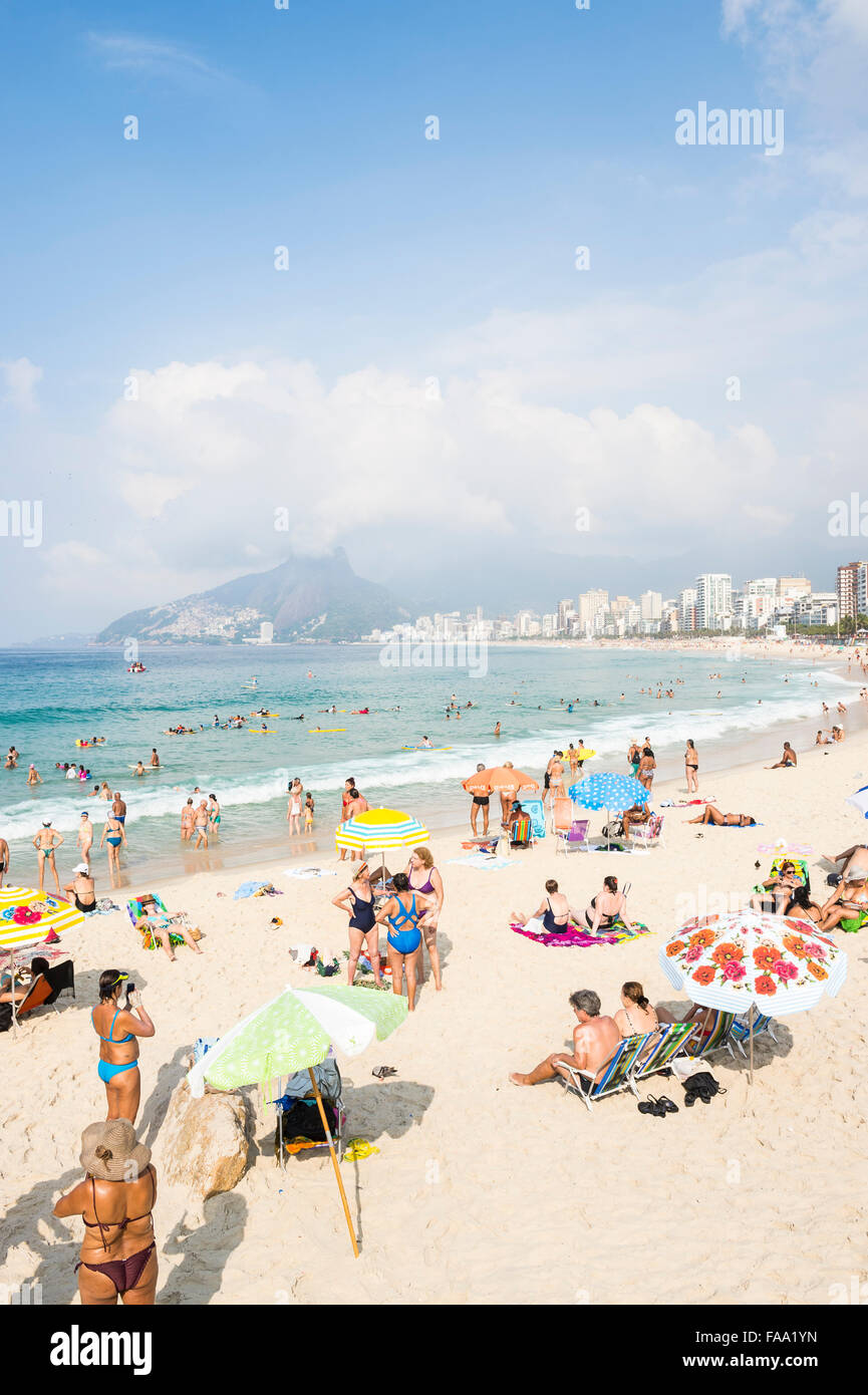 RIO DE JANEIRO, BRAZIL - MARCH 01, 2015: Beachgoers relax on Ipanema ...