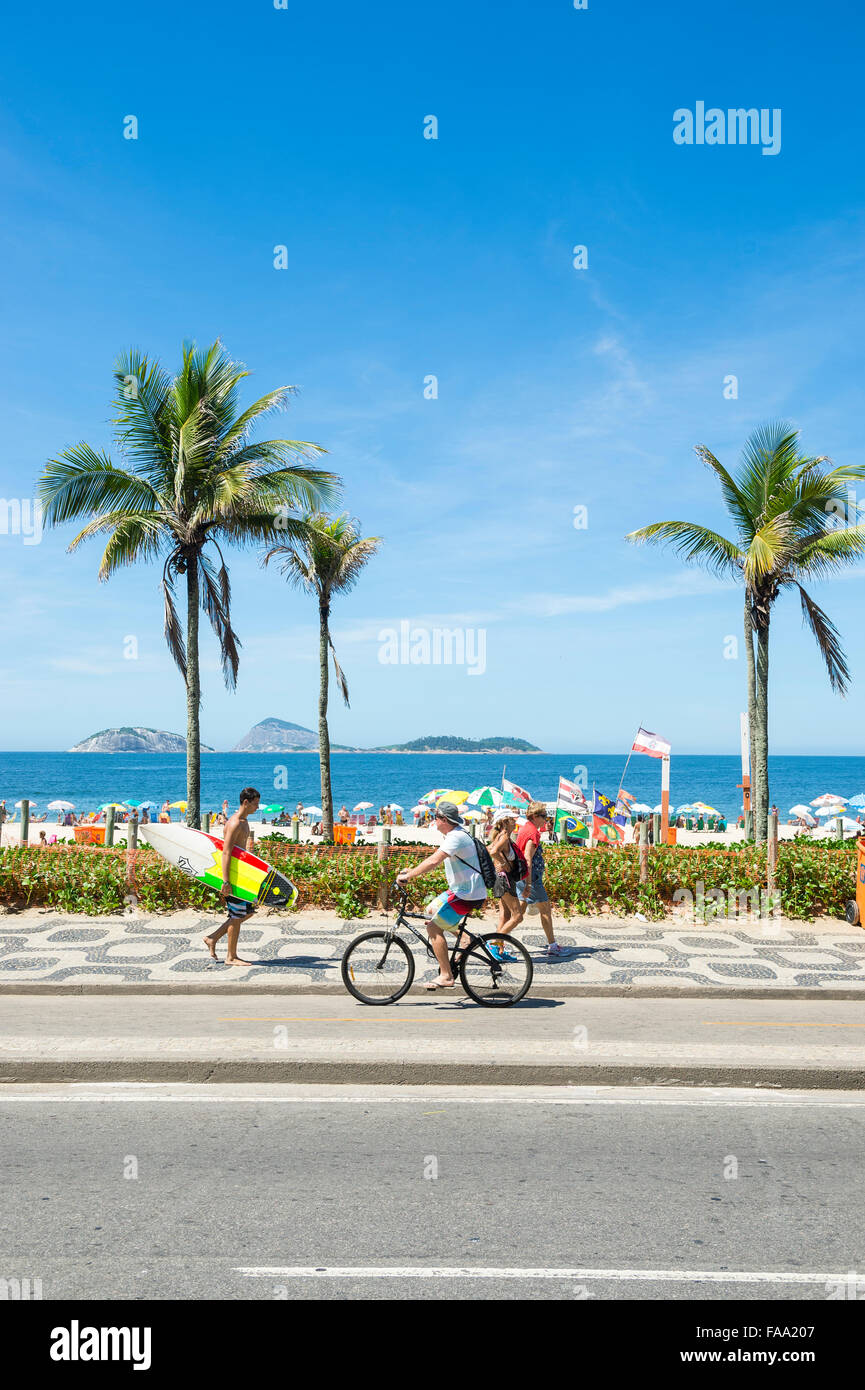 RIO DE JANEIRO, BRAZIL - MARCH 08, 2015: Brazilians walk and ride ...
