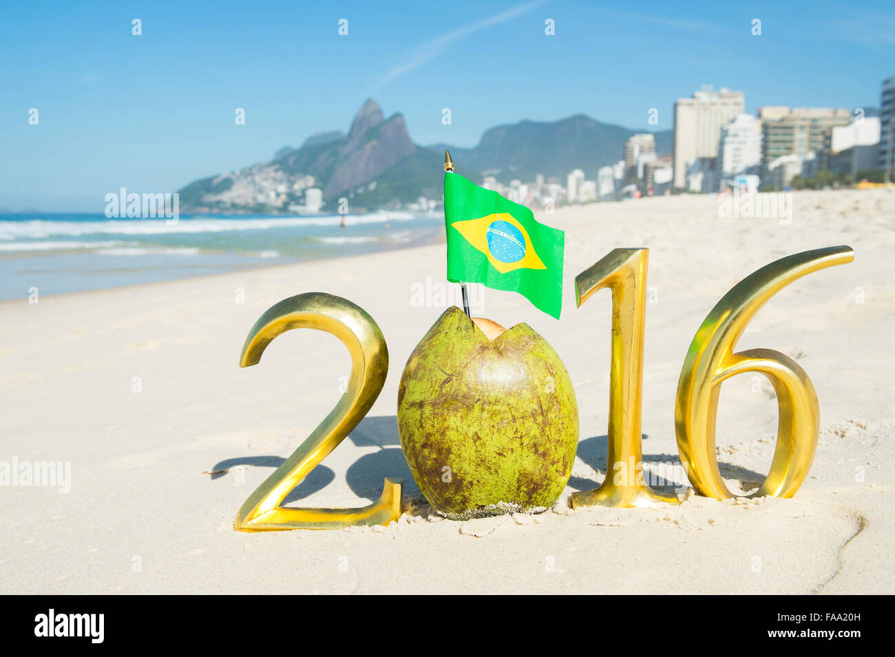 Gold 2016 message with Brazilian flag sticking out from green coco ...