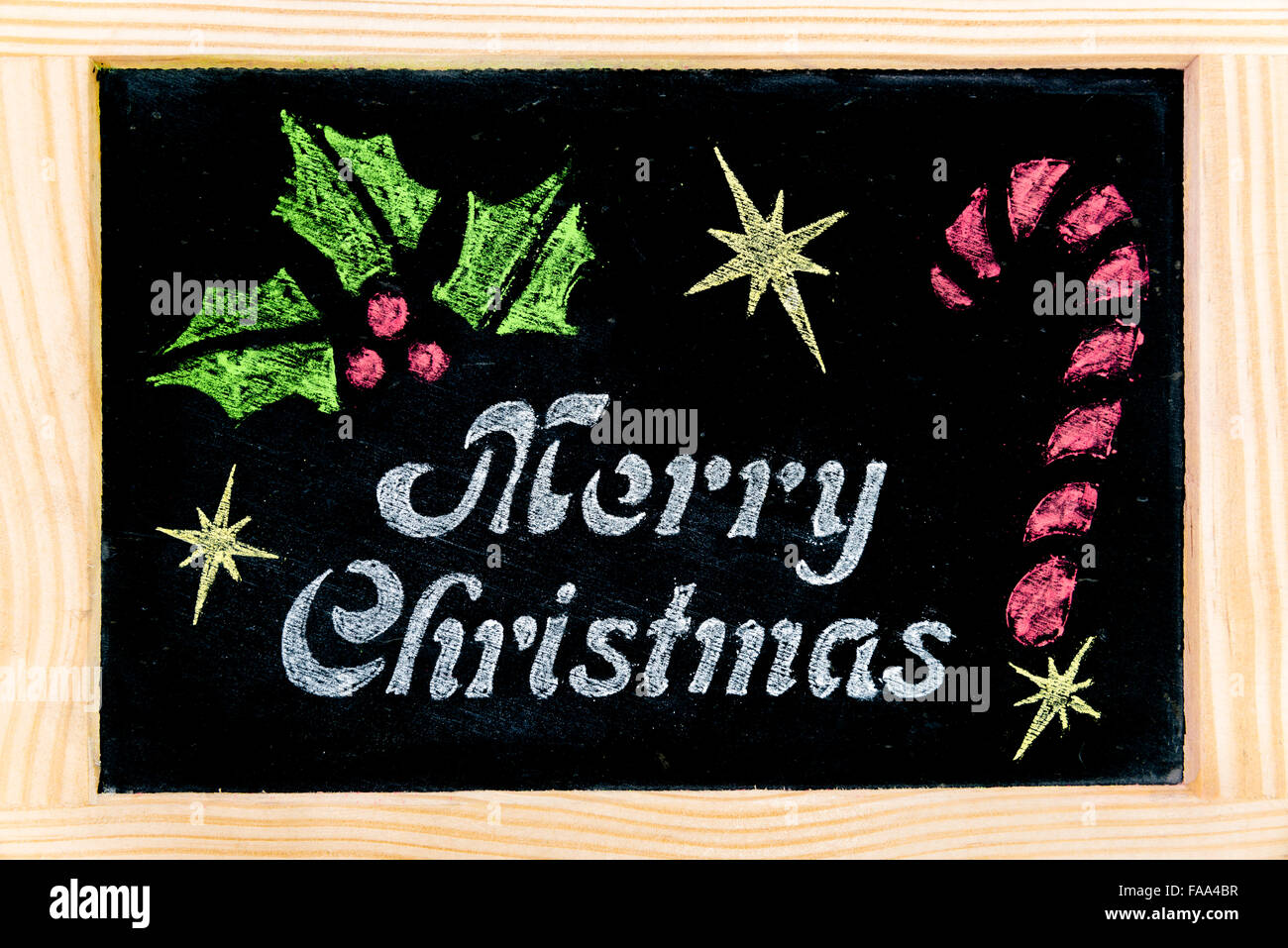 Wooden frame vintage chalkboard with Merry Christmas message and hand ...
