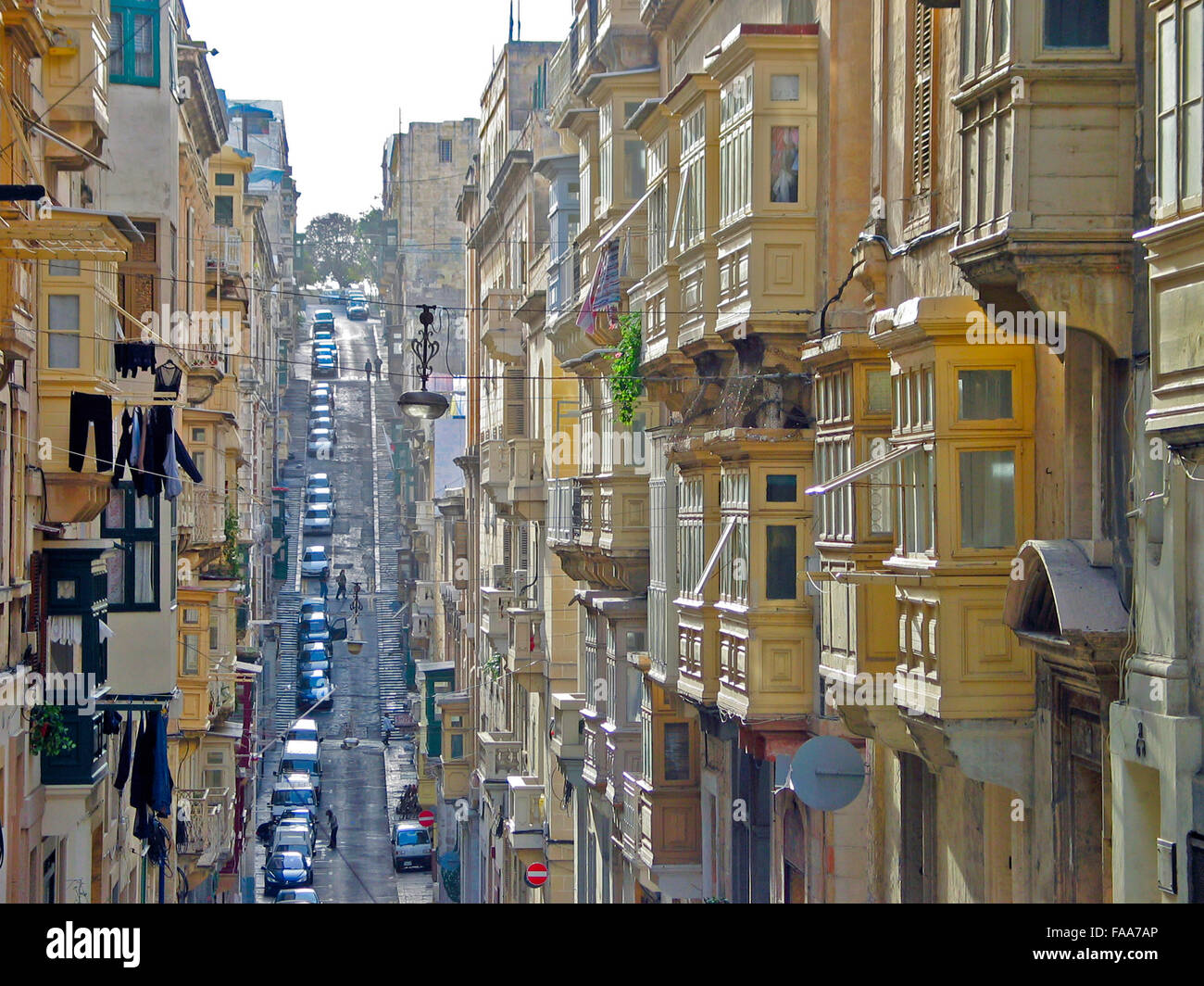 Maltese buildings in Valletta narrow and steep street Stock Photo - Alamy