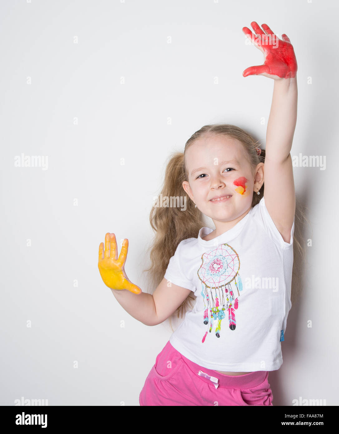 little child playing with bright colors Stock Photo - Alamy