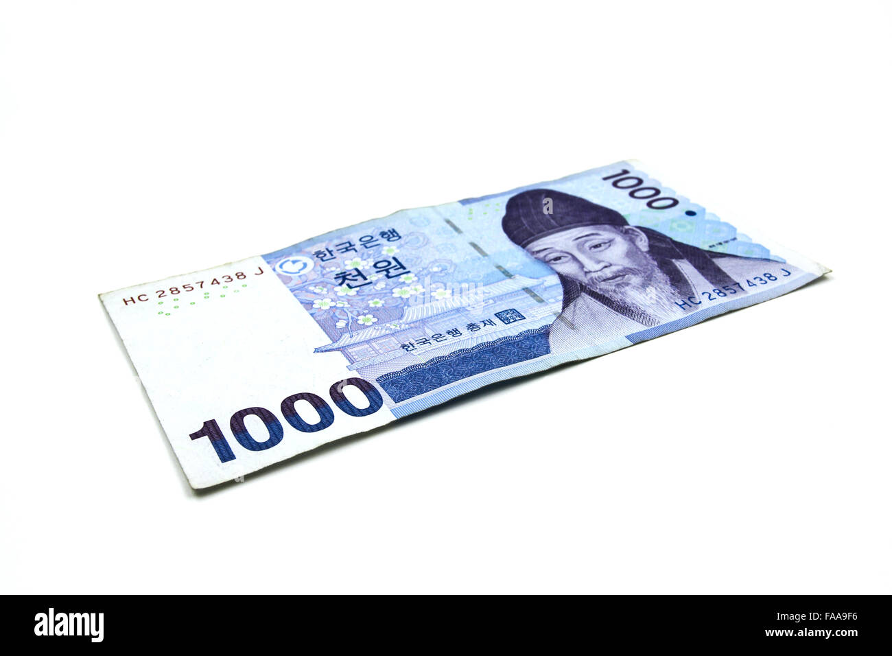 Korean Won currency bills isolated on white background Stock Photo - Alamy